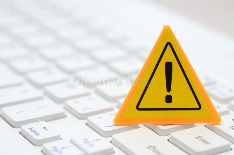 The Image of a Yellow Warning Sign on a Computer Keyboard Serves As a ...