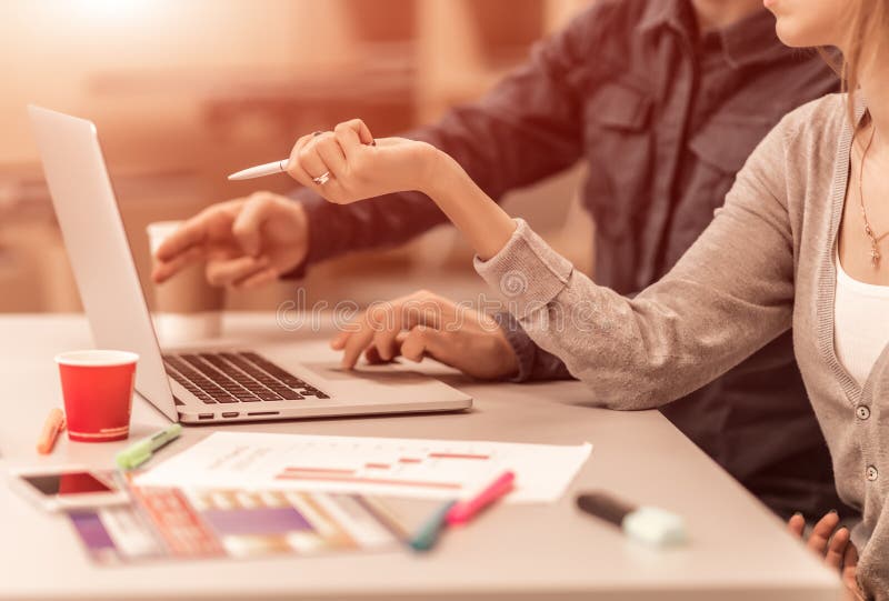 Image of Young Business Team Discussing Project at Computer Stock Image ...