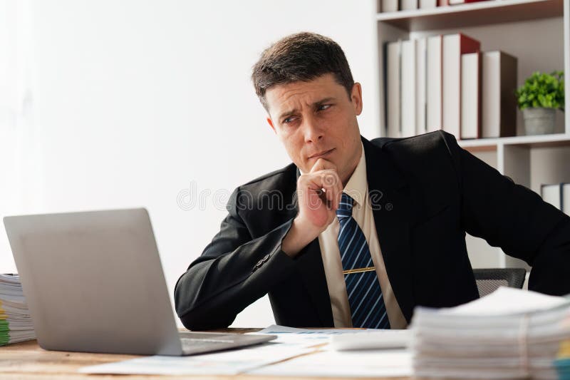 Image of Young Businessman Analyzing Work Using a Laptop at Office Stock Image - Image of ...