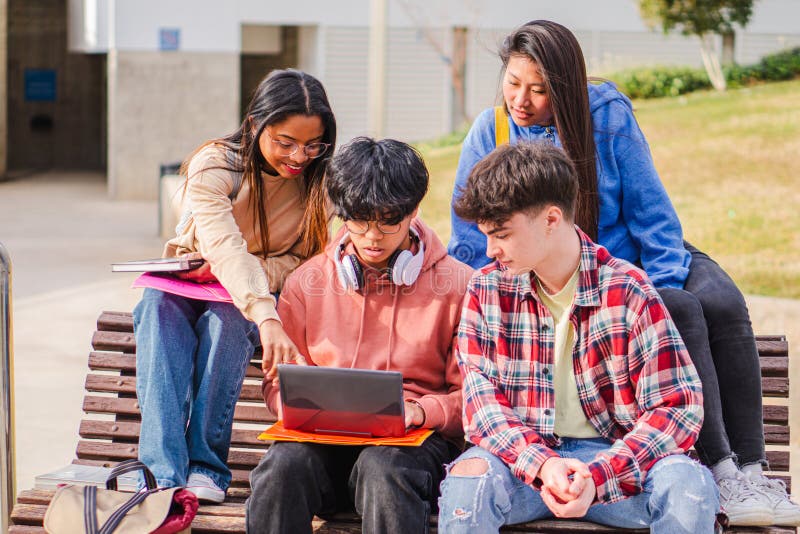 Image of Young Concentrated Students Sitting in Bench. Looking Aside ...