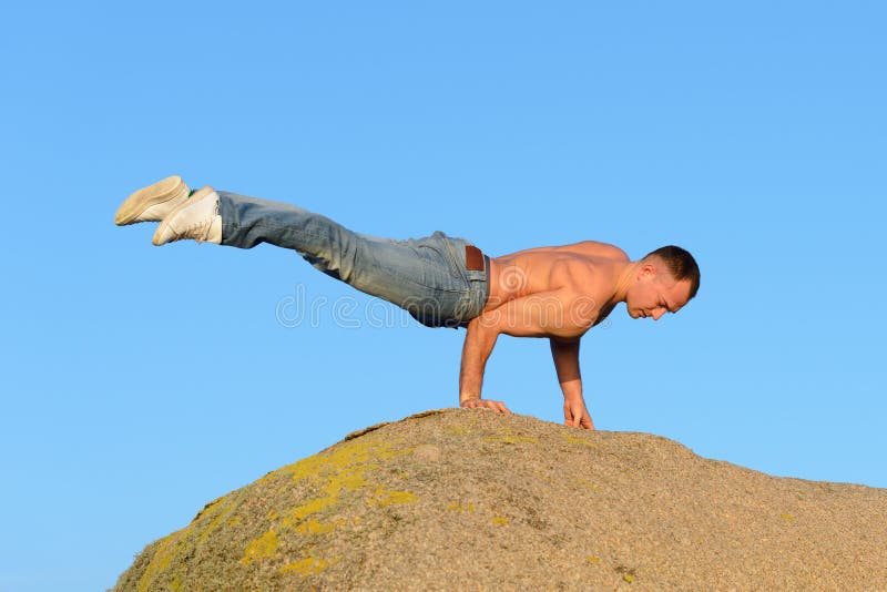Young Man Doing Handstand on the Rock Stock Photo - Image of hand ...