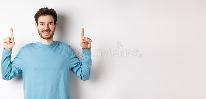 Image of Young Modern Guy with Beard Showing Advertisement on Copy ...
