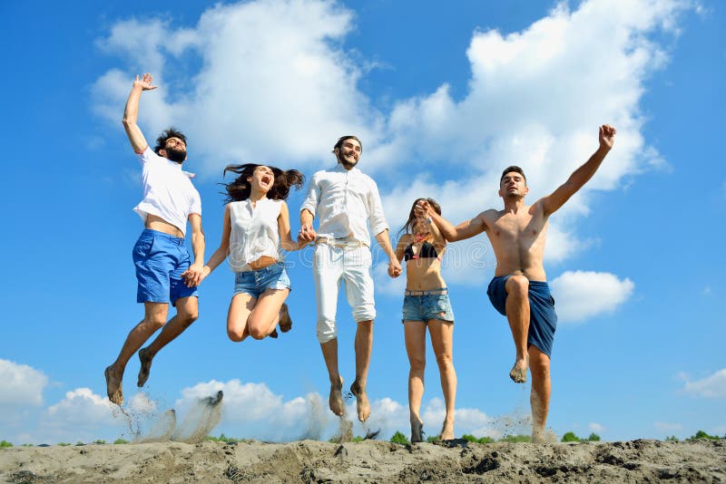 Image of Young People Jumping Together Outdoor. Stock Photo - Image of ...