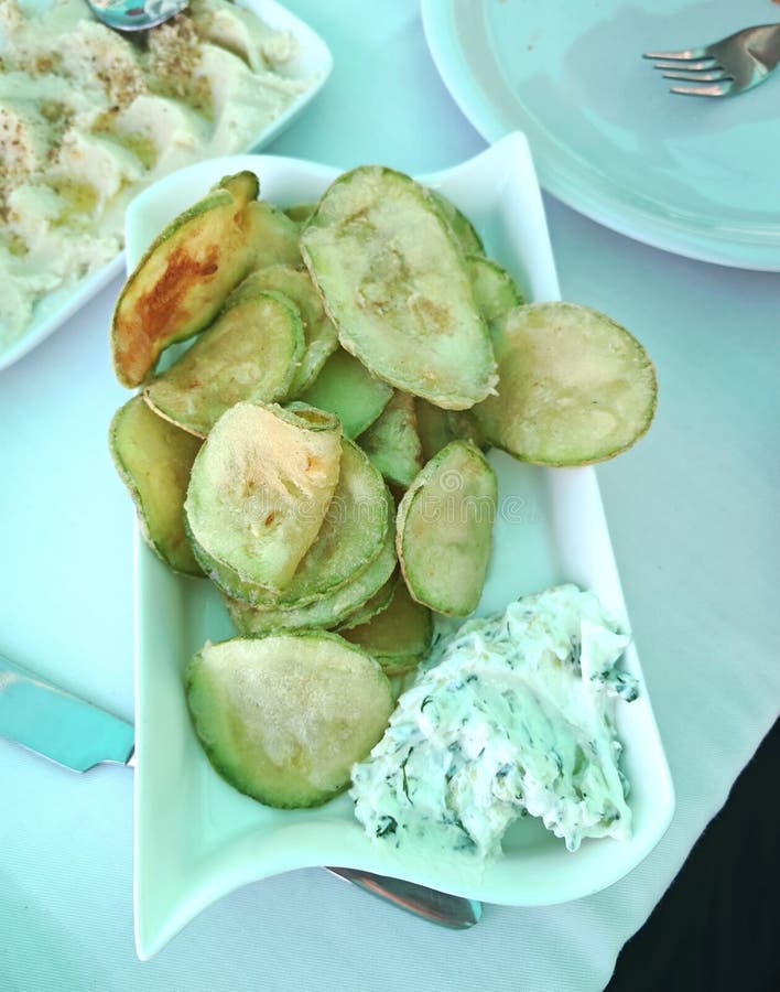 Image of Zucchini Chips Snack with Tsatsiki and Garlic Stock Photo ...