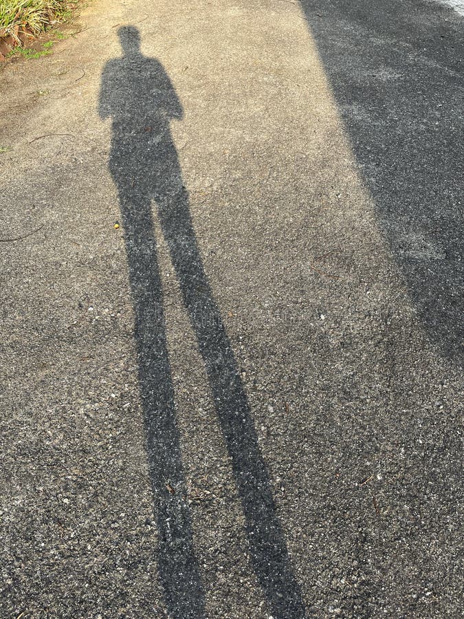 Una Sombra Humana En Buen Aspecto De Rayos Solares Imagen de archivo ...