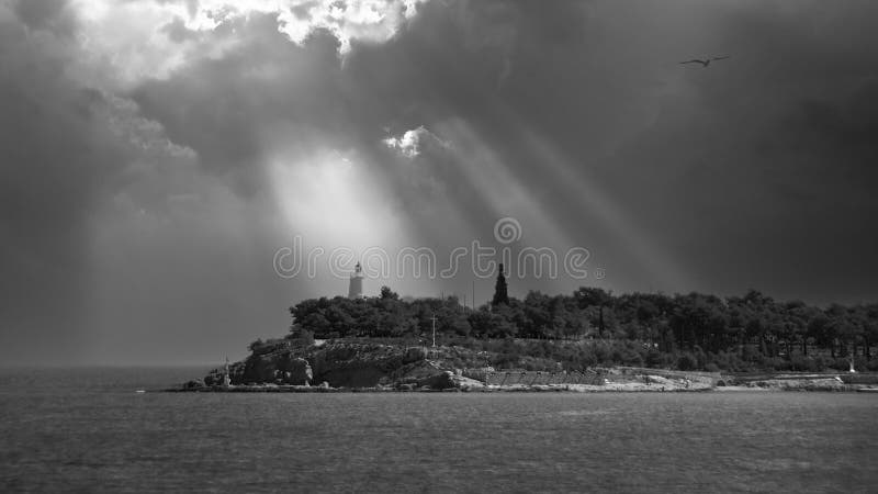 Sun Rays after Storm Over Lighthouse.Greece . Stock Image - Image of ...