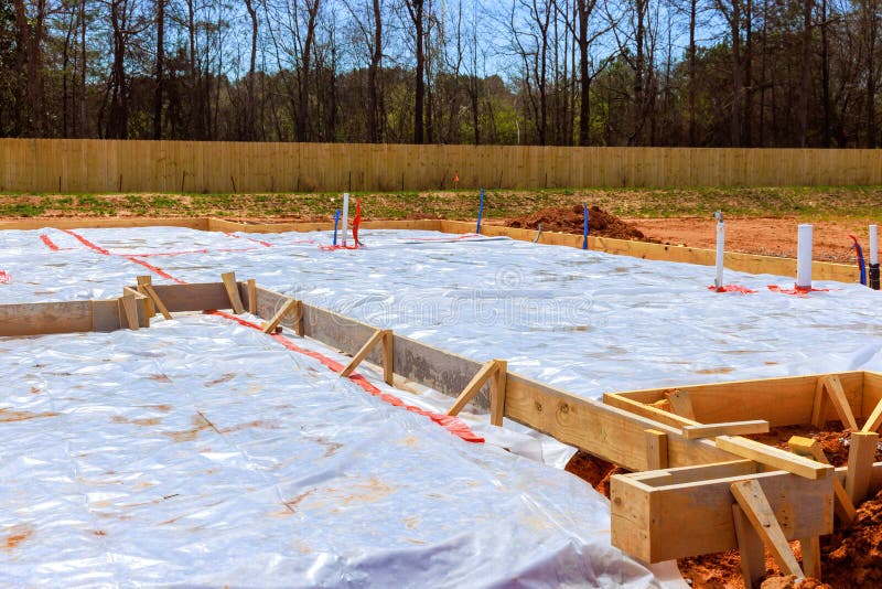 Immediately Prior To Pouring of Foundation, Ground is Covered with ...