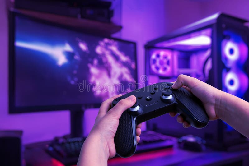 Immersive Gaming Setup Featuring a Gamer Playing on a Gaming PC with a ...