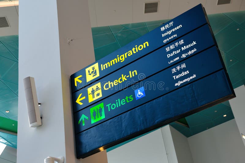 Immigration, Check-in and Toilet Signs Stock Photo - Image of center ...