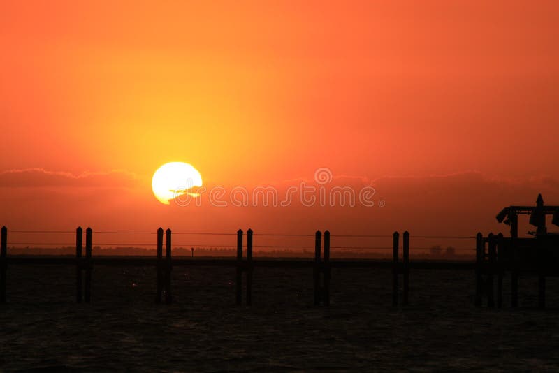 An Imminent Island Multi-colored Sunset Stock Photo - Image of colors ...