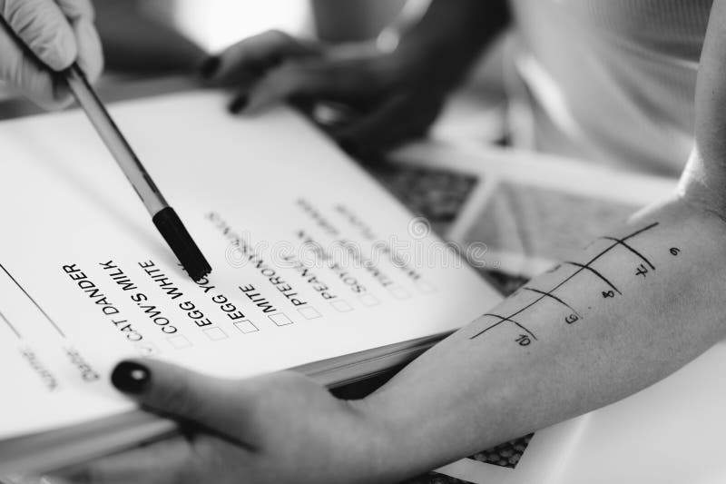 Immunology Doctor Looking at a List with Allergens Stock Image - Image ...