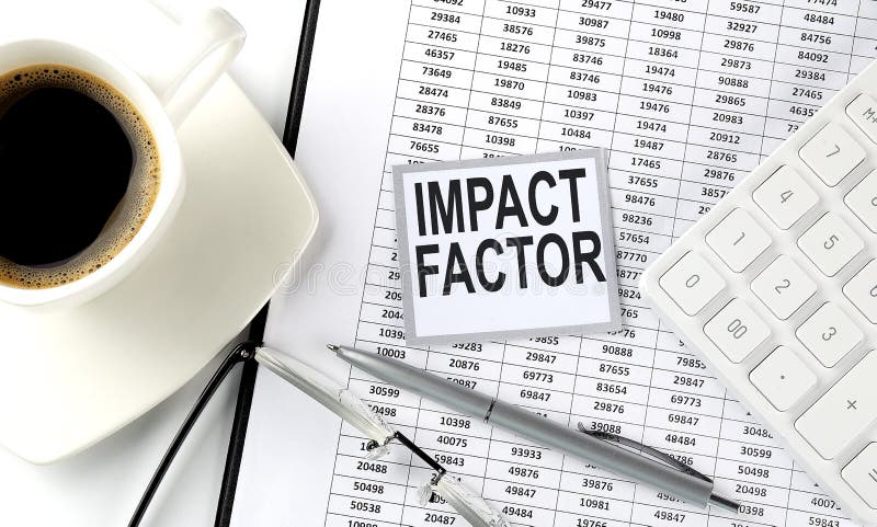 IMPACT FACTOR Text on Sticky on the Chart with Coffee,pen and ...