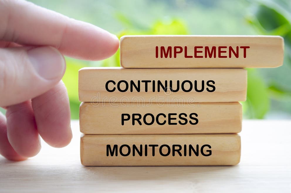 Implement Continuous Process Monitoring Text on Wooden Blocks ...