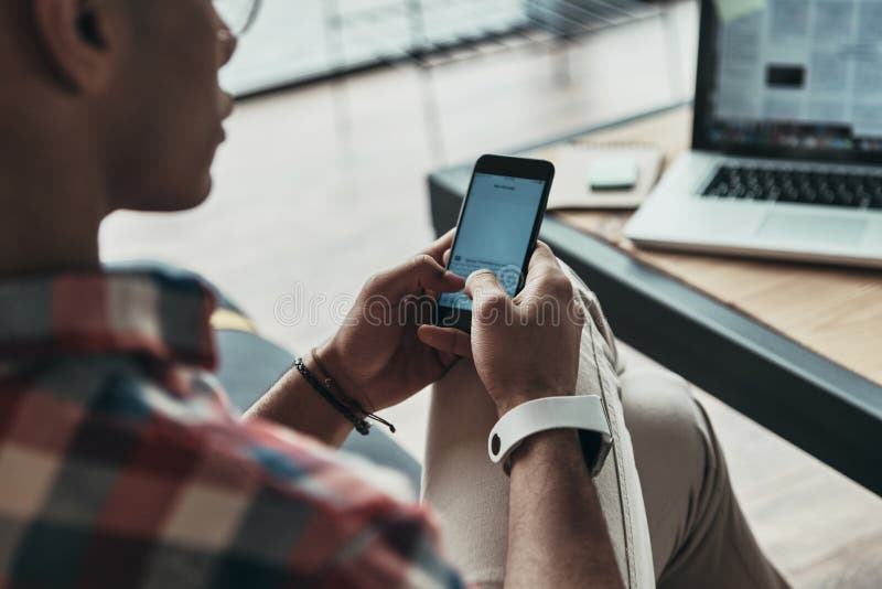 Important Message. Close Up Top View of Young Man Using His Smart Phone ...