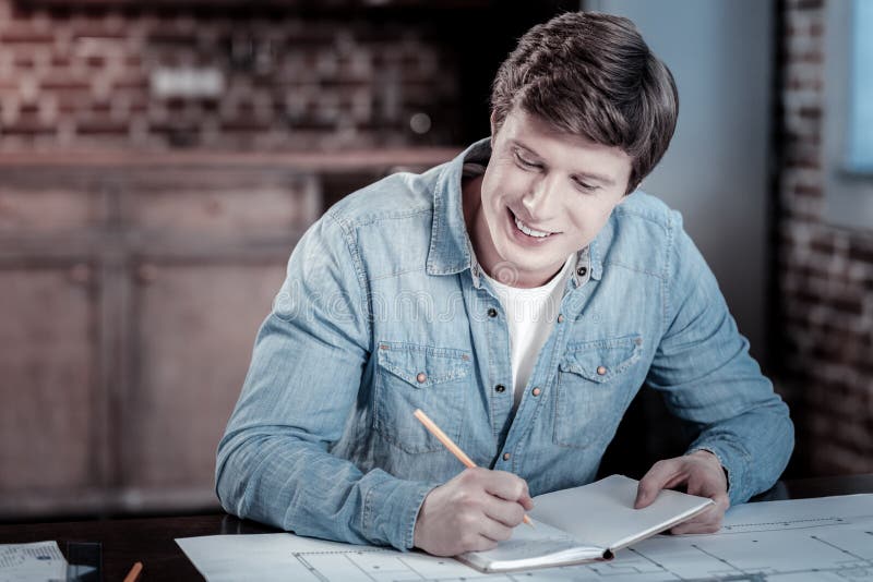 Adorable Male Engineer Writing Down Tips Stock Photo - Image of ...