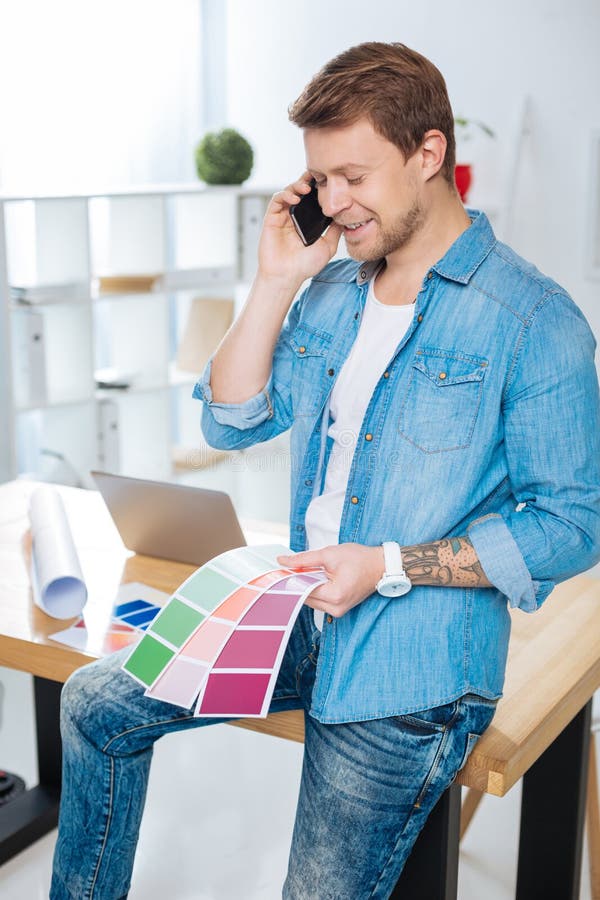 Creative Designer Holding Color Palettes while Talking on the Phone ...