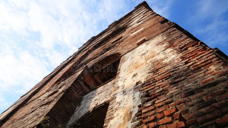 Imposing Aged Brick Tower Crumbling Architecture Reaching Towards a ...