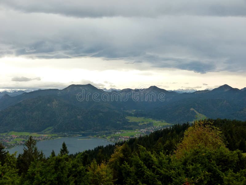 Imposing Landscape with Trees Behind it a Lake and Mountains in the ...