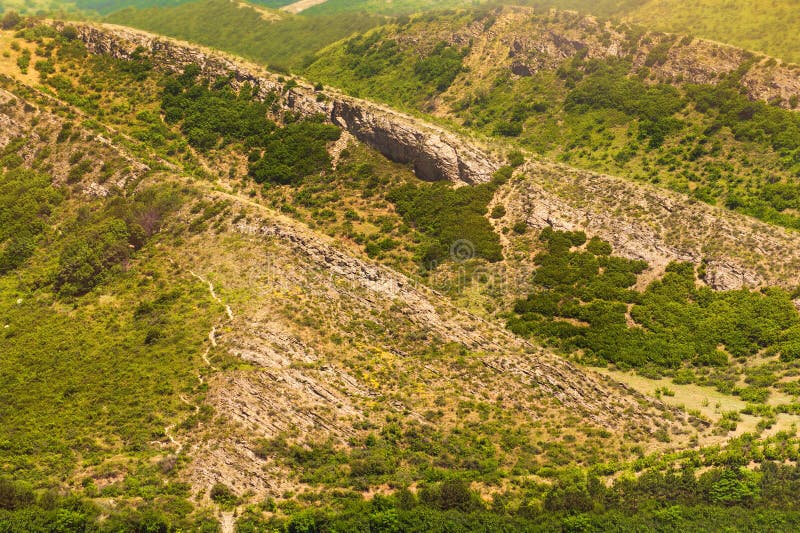 Imposing Layers of Yellow Mountain Rock Cliffs Stock Photo - Image of ...