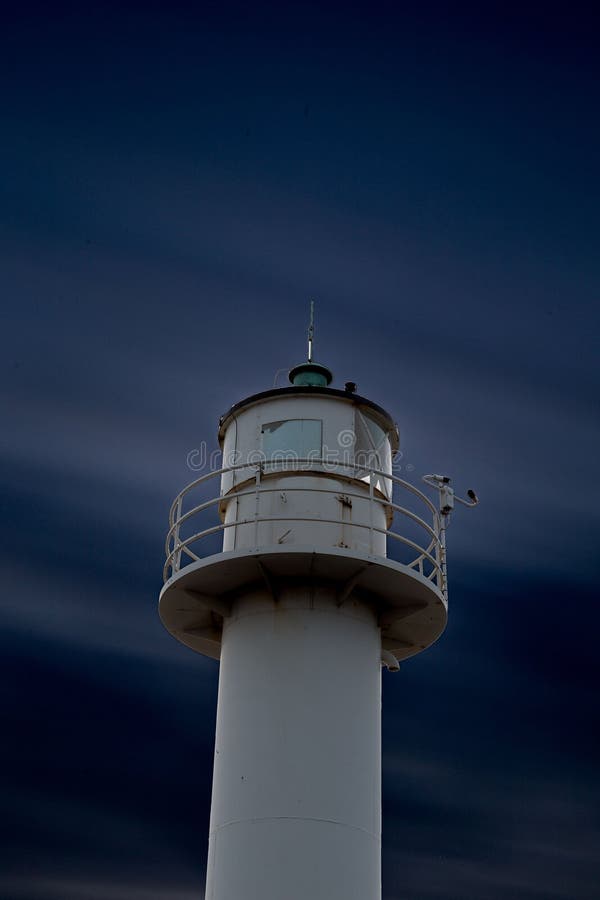Impressive Lighthouse Tower Rising High Against a Cloudy Sky Stock ...