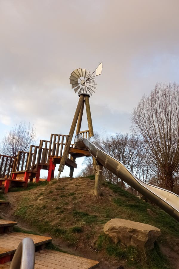 Impressive Playground Slide with a Windmill on Top . Heavy Dark Clouds ...