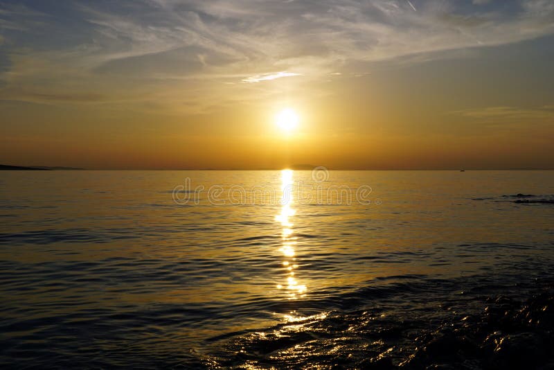 Impressive Smoothly Sea Surface during the Sundown at Golden Hour Stock ...