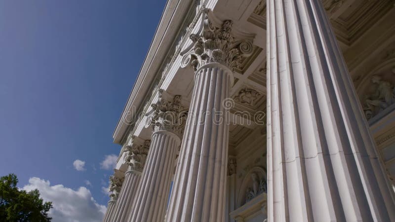 Dramatic Classical Columns Towering Against Vivid Blue Cloudy Sky Stock ...