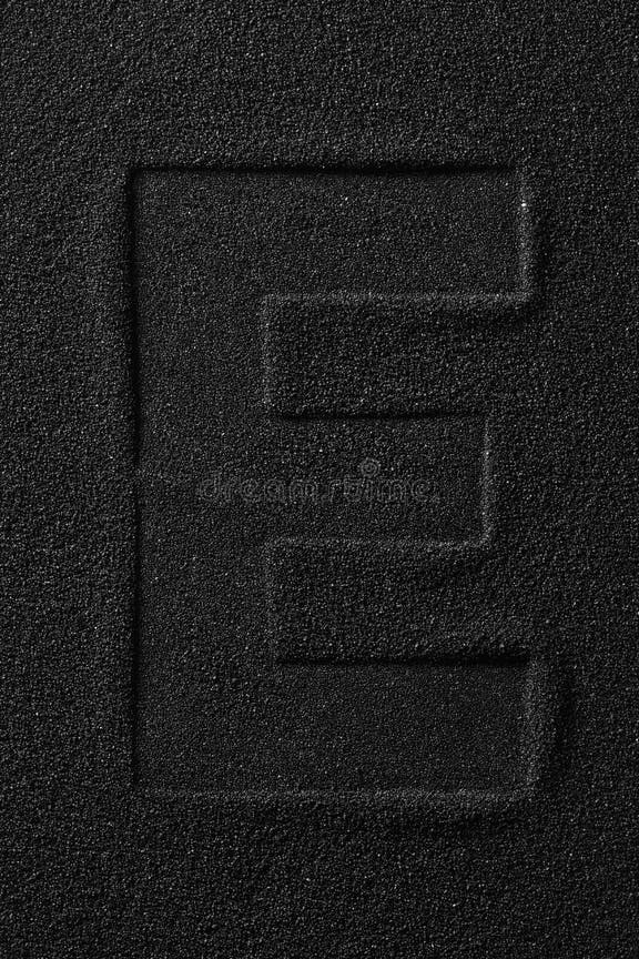 Imprint of a Letter Squeezed Out on Black Sand. Stock Photo - Image of ...