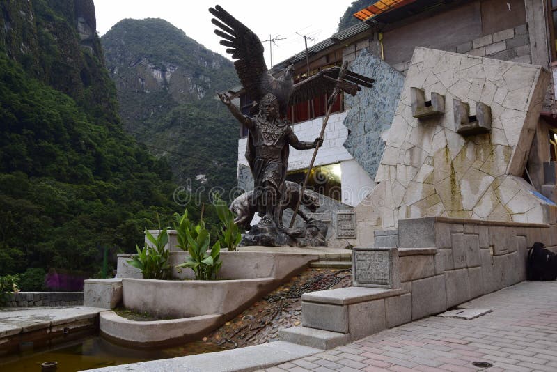 Inca Statue with an Eagle on the Square in Aguas Calientes, Peru Stock ...
