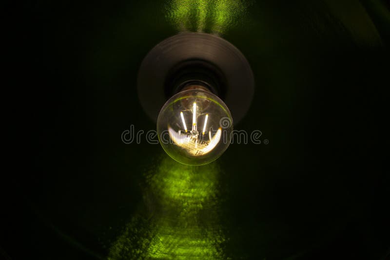 Incandescent Lamp in the Dark. Heating Filament in the Lamp Stock Photo ...