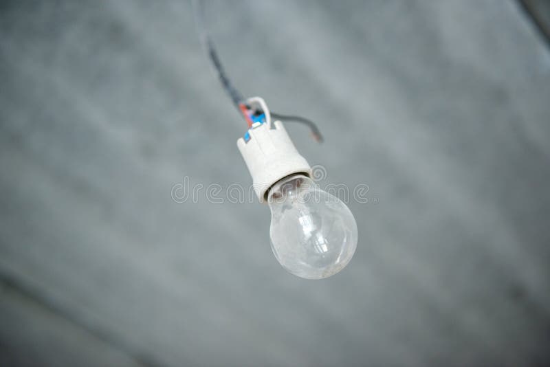 Incandescent Lamp. Obsolete Light Bulb on the Ceiling in an Empty ...