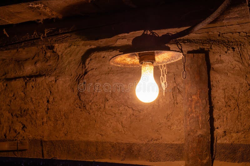 Incandescent Lamp in an Old House. Vintage Ceiling Lamp and Old Large ...