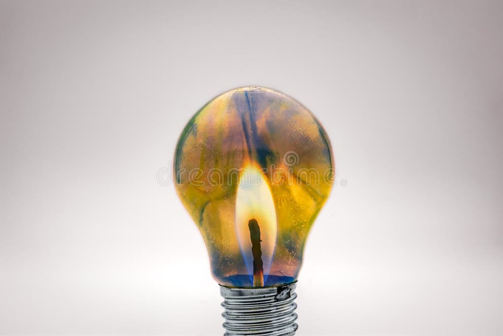 Incandescent Light Bulb Burned Out with Candle Flame Stock Image ...