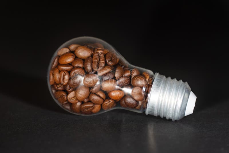 Incandescent Light Bulb with Coffee Beans on White Stock Photo - Image ...
