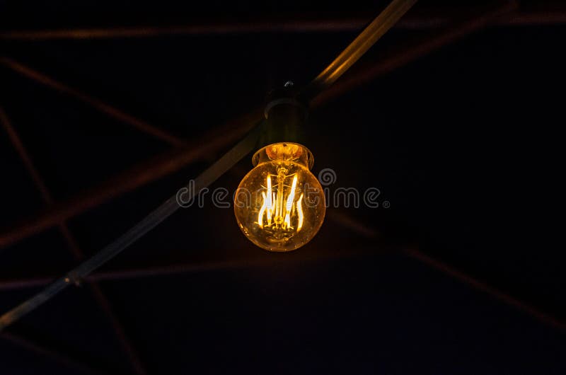 Incandescent Light Bulb Illuminates the Dark Stock Photo - Image of ...