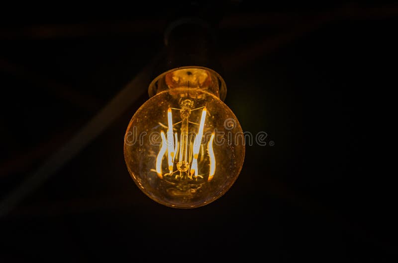 Incandescent Light Bulb Illuminates the Dark Stock Image - Image of ...