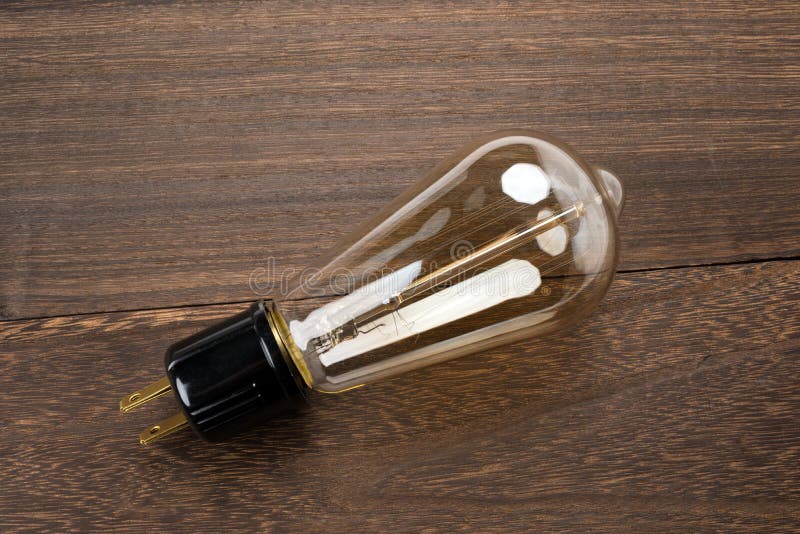 Incandescent Light Bulb and Plug Stock Photo - Image of table ...