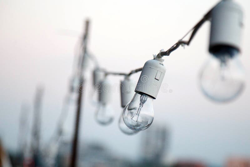 Incandescent Light Bulb on Wire Stock Photo - Image of illumination ...