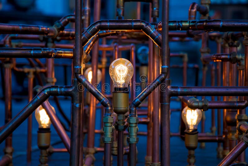 Incandescent Light Bulbs between Pipes Stock Image - Image of bulbs ...