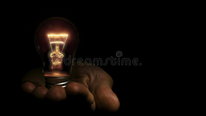 Incandescent Light with Voltage Drop Bulb on Black Background Stock ...