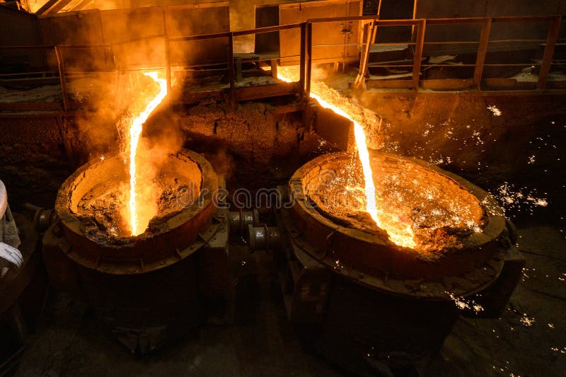 A Stream of Hot Metal, Molten Steel Flowing Along a Guide Chute. Stock ...