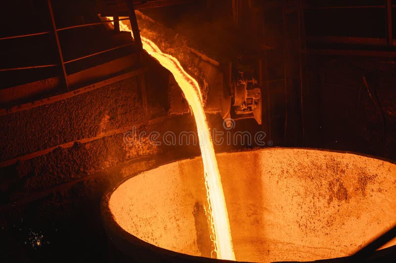 A Stream of Hot Metal, Molten Steel Flowing Along a Guide Chute. Stock ...