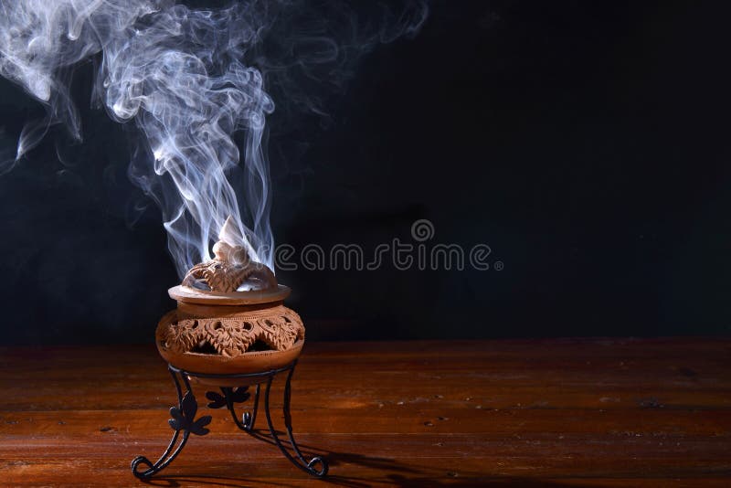 Incense Burning in an Incense Burner with Candles on the Table for ...