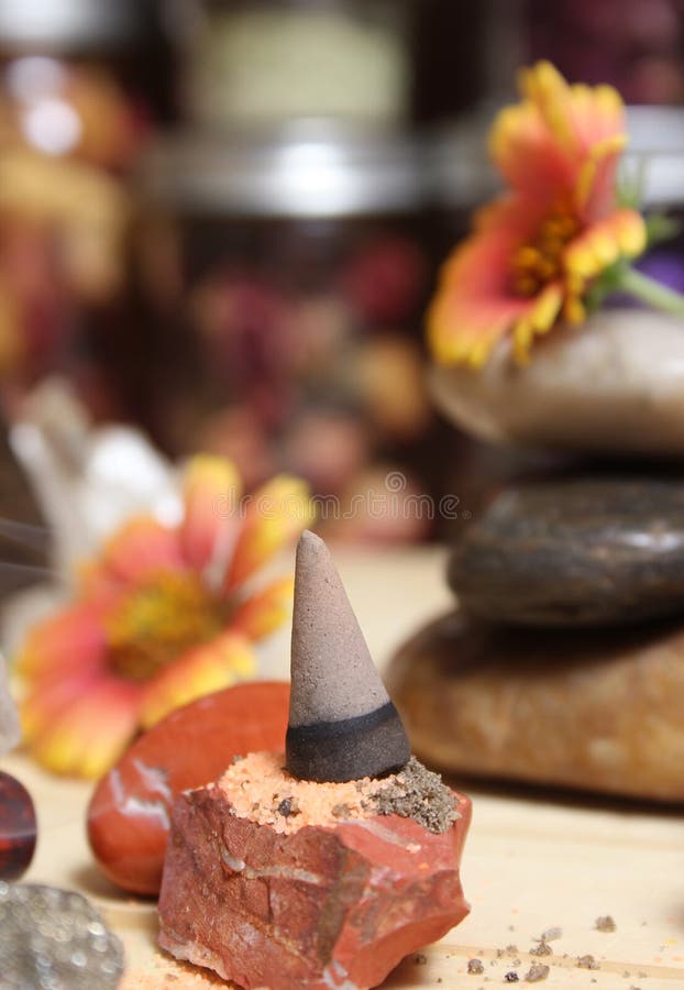 Incense Cone on Stone Slab with Crystals and Flowers Stock Image ...