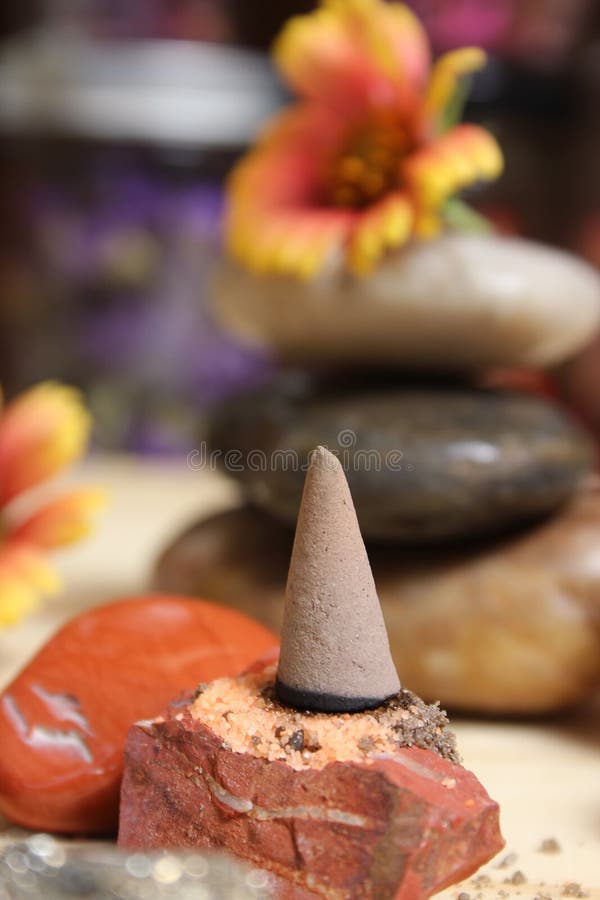 Incense Cone on Stone Slab with Crystals and Flowers Stock Photo ...