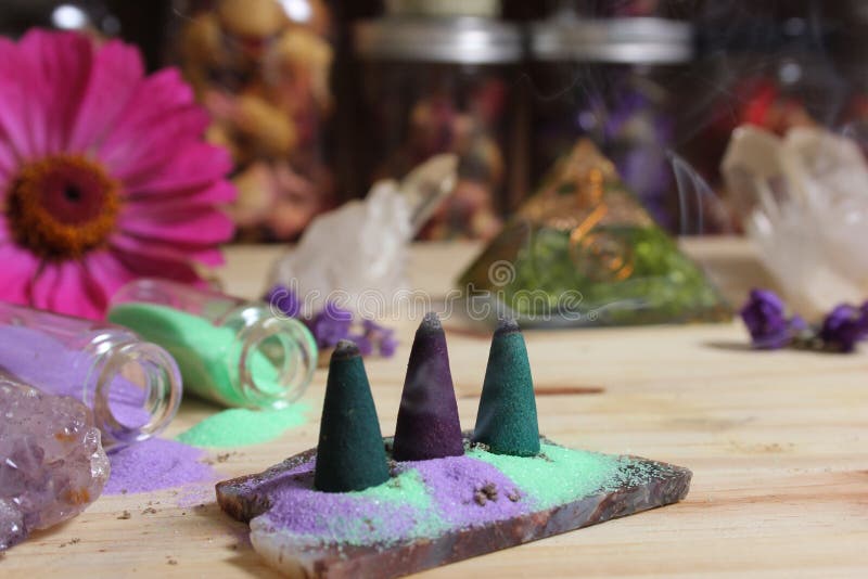 Incense Cones on Stone Slab with Crystals and Flowers Stock Photo ...
