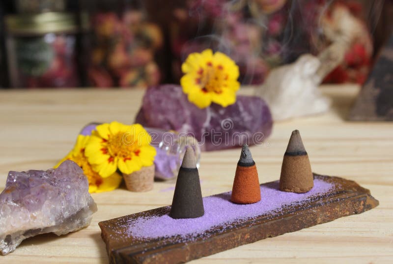 Incense Cones on Stone Slab with Crystals and Flowers Stock Image ...