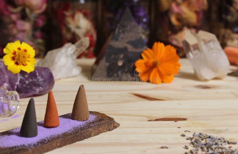 Incense Cones on Stone Slab with Crystals and Flowers Stock Photo ...