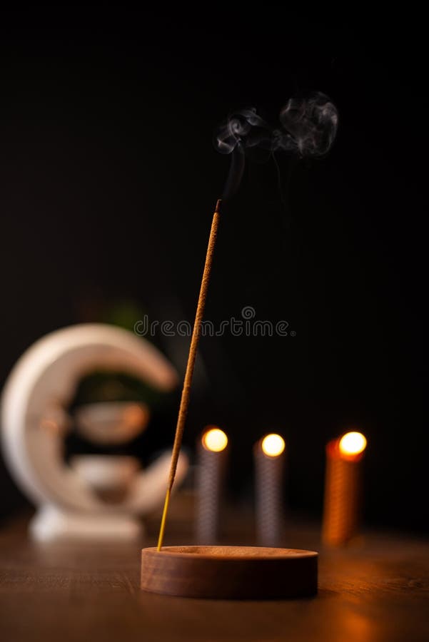 An Incense Stick Burning and Generating Aromatic Smoke Surrounded by ...