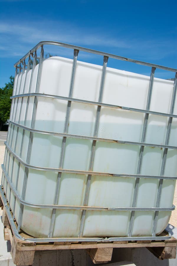 Construction Sites Water Tank in a Crooked Position on a Wooden Pallet ... Construction Sites Water Tank in a Crooked Position on a Wooden Pallet ...